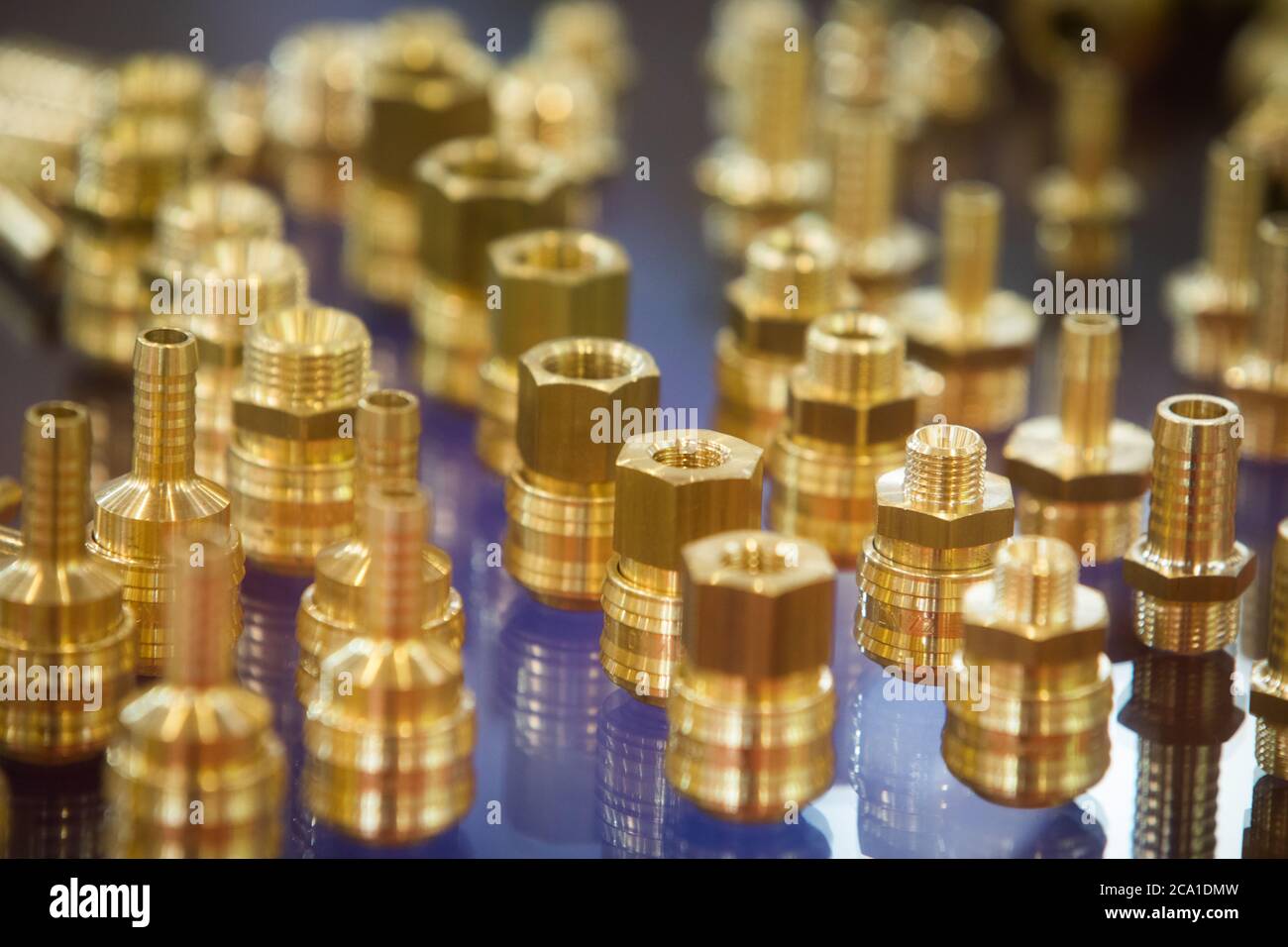 Color close up of some various golden screws and adapters Stock Photo ...