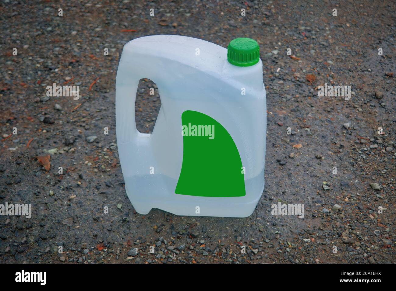 An empty white plastic canister stands on the ground close-up Stock ...
