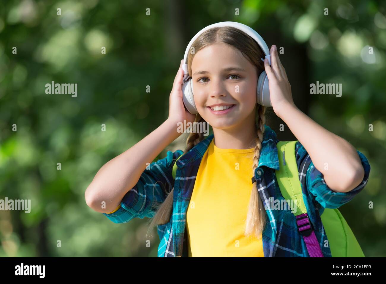 Take your headphones wherever you go. Happy child wear headphones ...