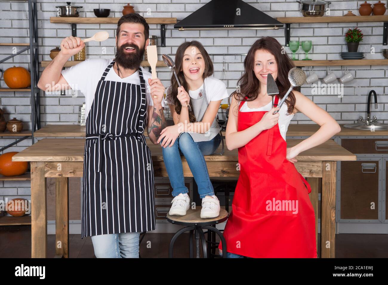Parents mom dad and daughter cooking food together, cook with love ...