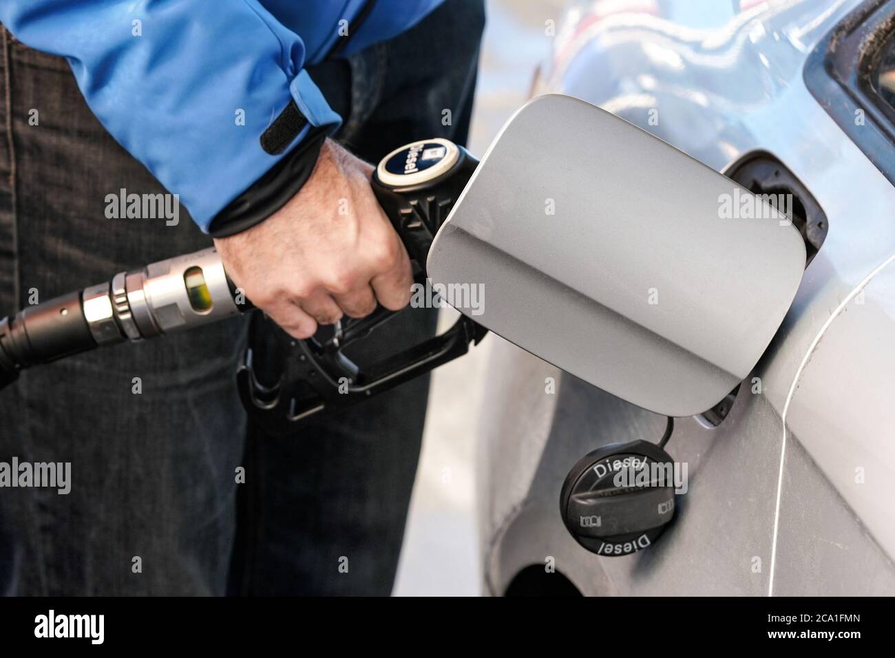 Man Refilling High Resolution Stock Photography and Images - Alamy