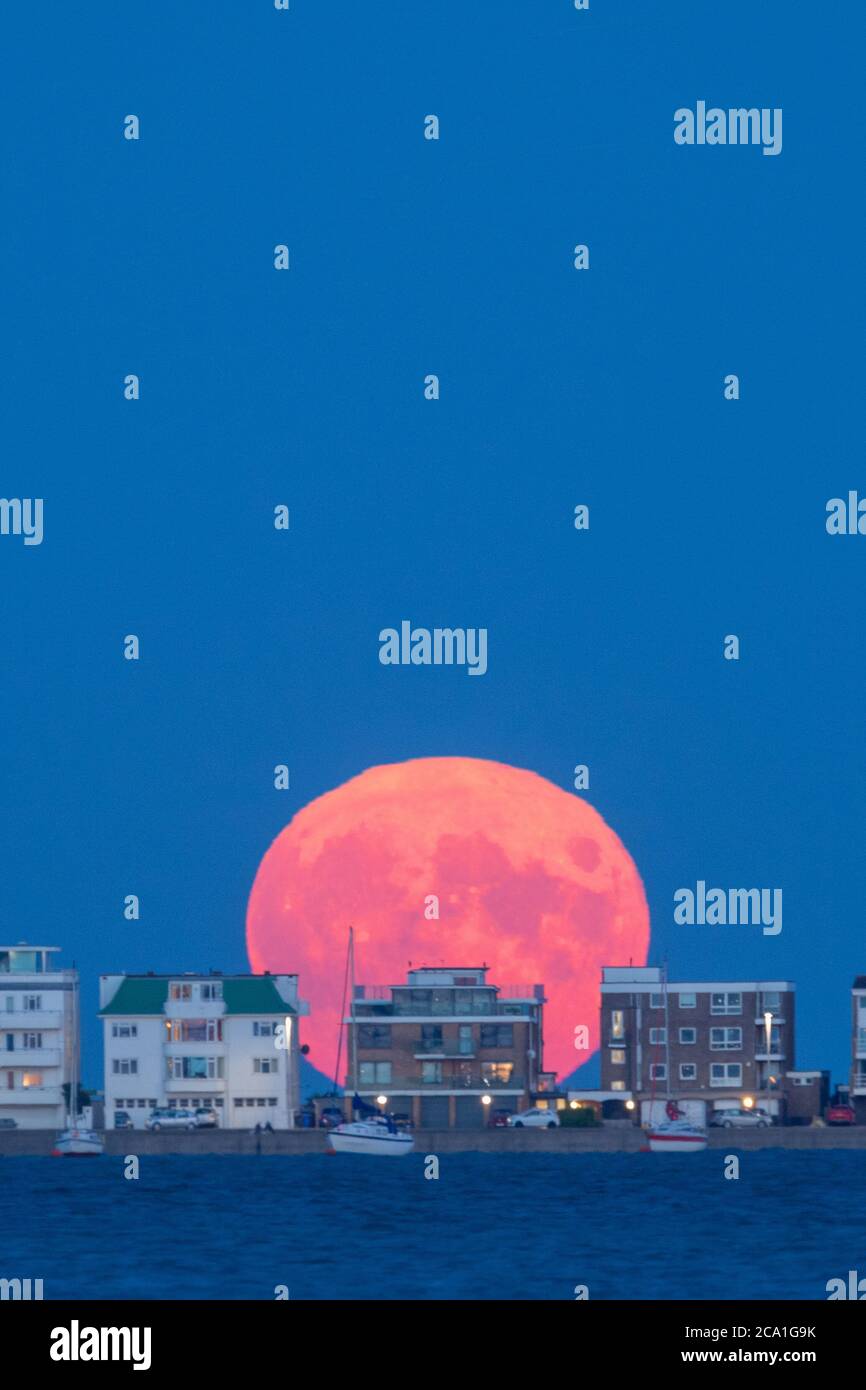 The August ("Sturgeon") full moon rising over the famous Millionaire's ...