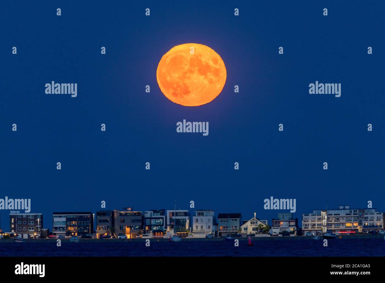 The August ("Sturgeon") full moon rising over the famous Millionaire's ...