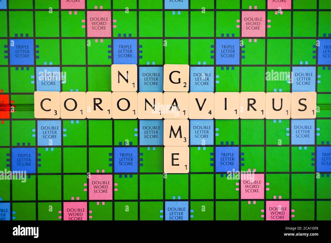Close up of scrabble board game tiles spelling message CORONAVIRUS NO ...
