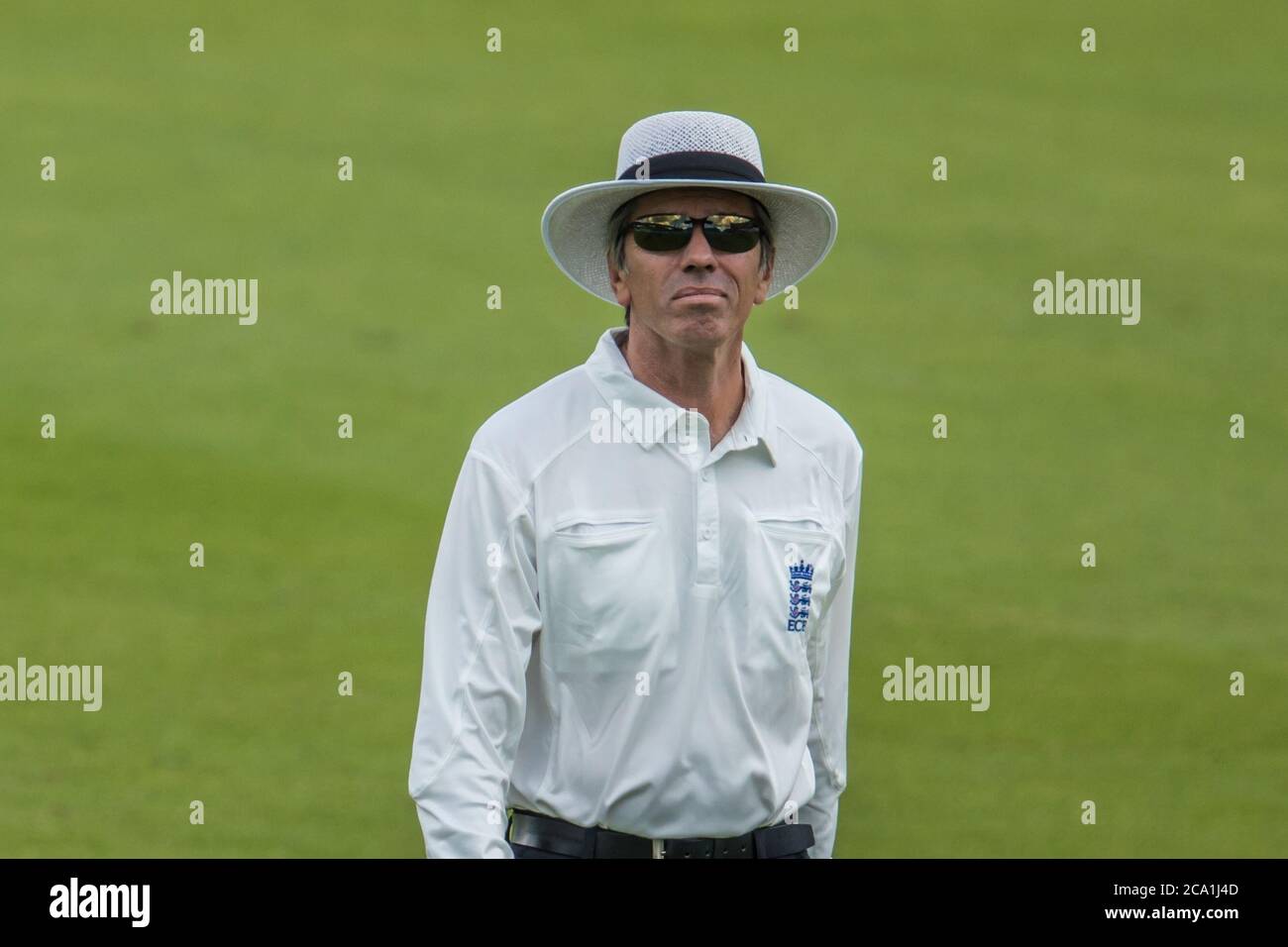 London, UK. 3 August, 2020.Umpire Nigel Llong in the middle as Surrey ...