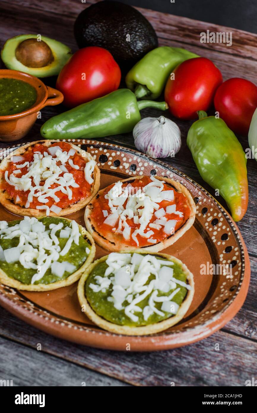 Mexican sopes with grated cheese and salsa, Traditional breakfast in ...