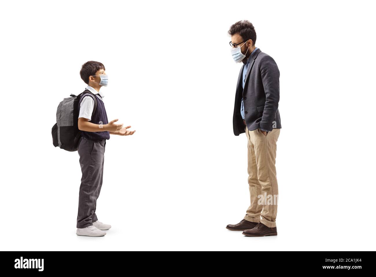 Full length profile shot of schoolboy explaining something to a bearded ...