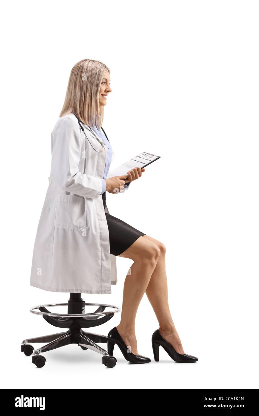 Full length profile shot of a young female doctor sitting on a chair ...