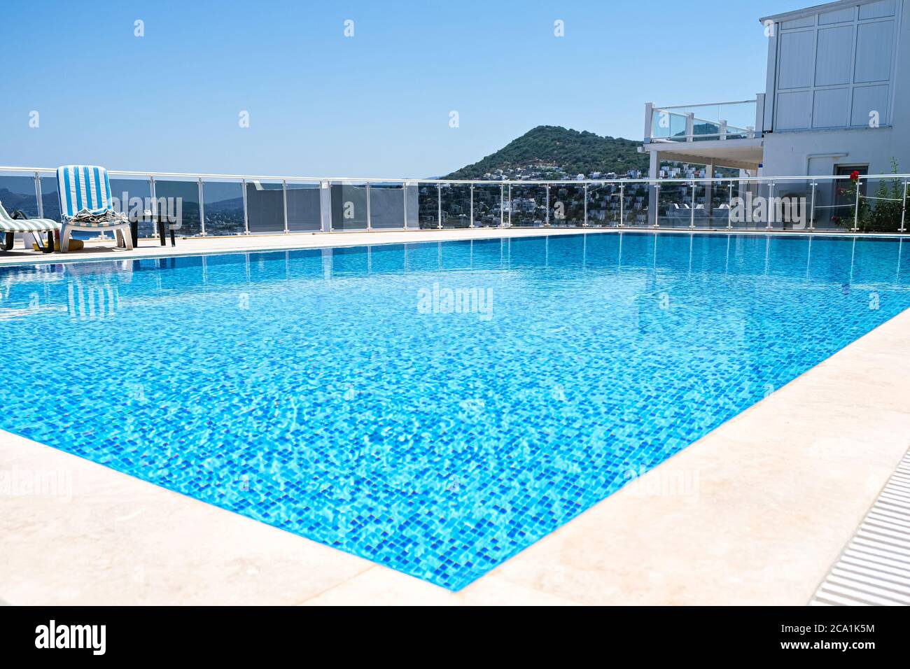 Swimming pool with turquoise color water at hotel or holiday village ...