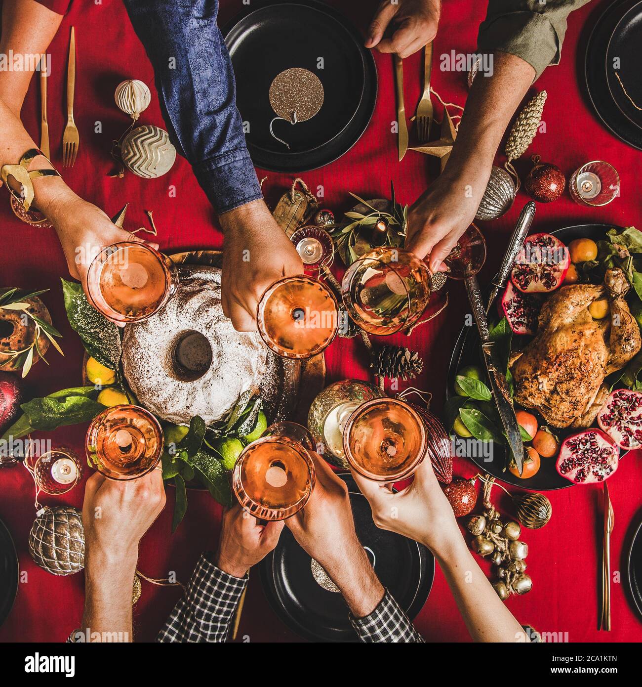 Flat-lay of family celebrating Christmas at festive table, square crop ...