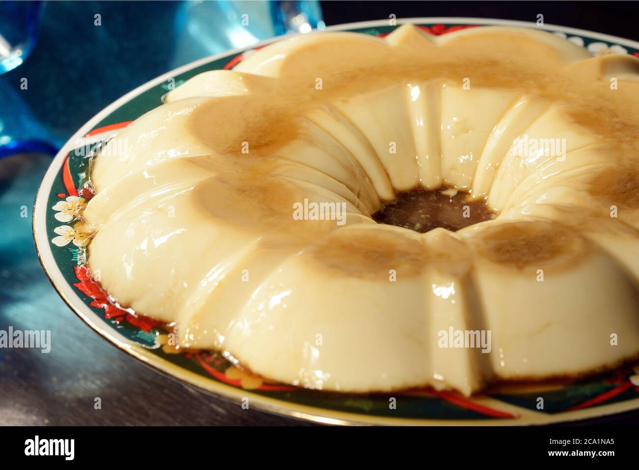 Brazilian gastronomy. Traditional milk pudding with caramelized syrup ...