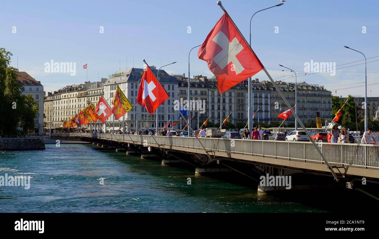 Flags of Switzerland and the City of Geneva on a bridge in Geneva ...