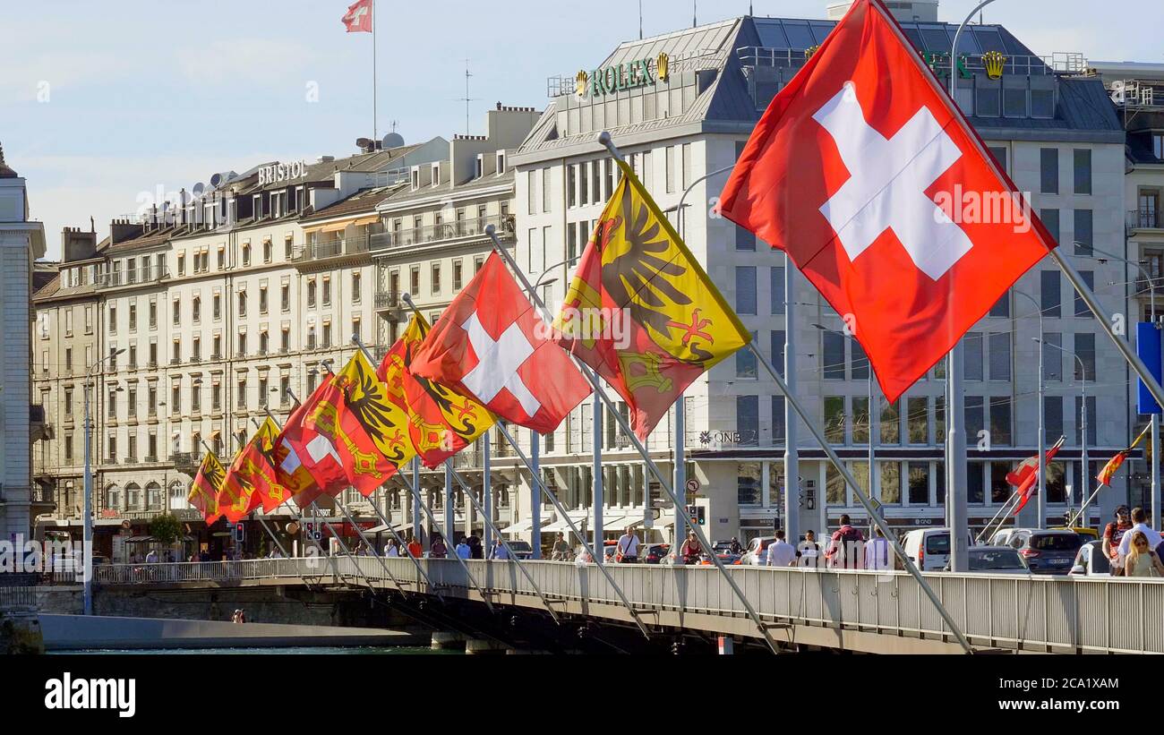 Flags of Switzerland and the City of Geneva on a bridge in Geneva ...