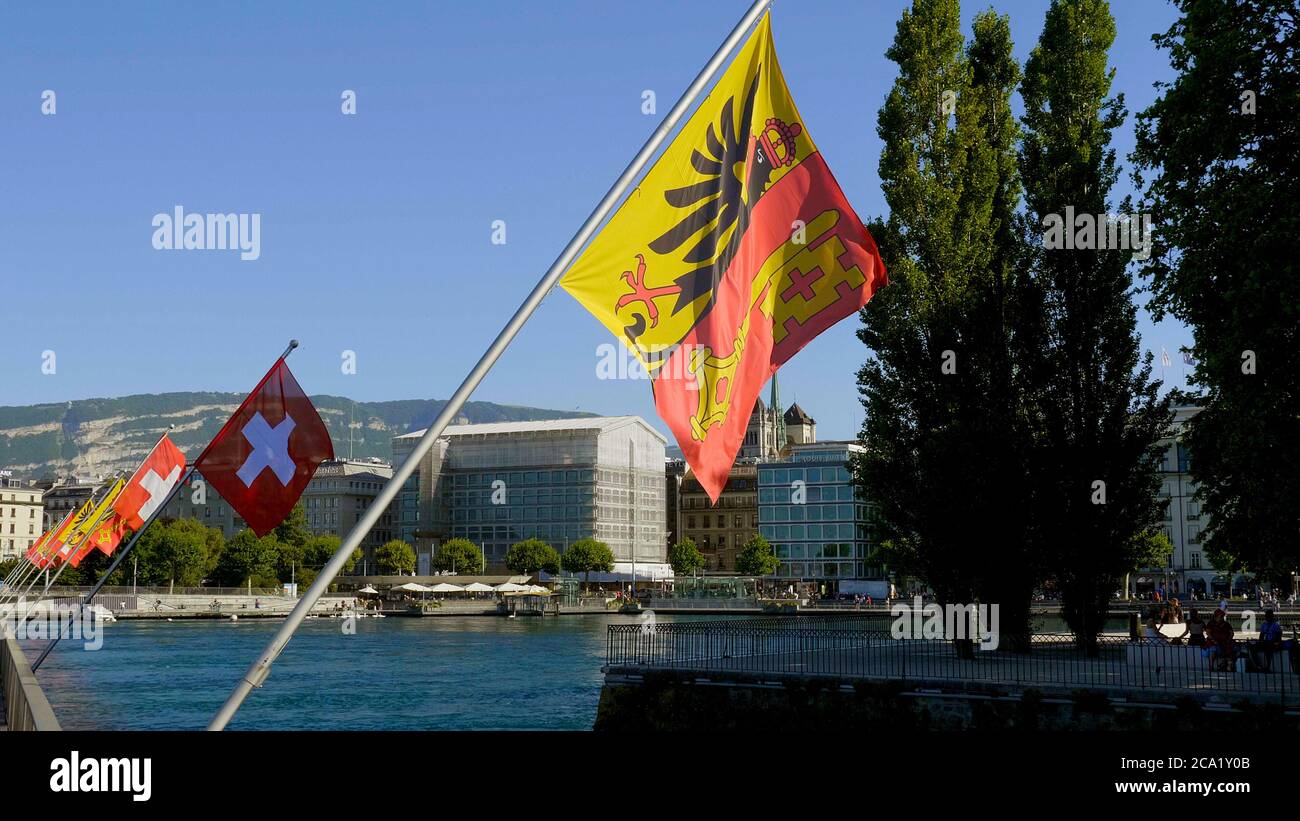 Flags of Switzerland and the City of Geneva on a bridge in Geneva ...