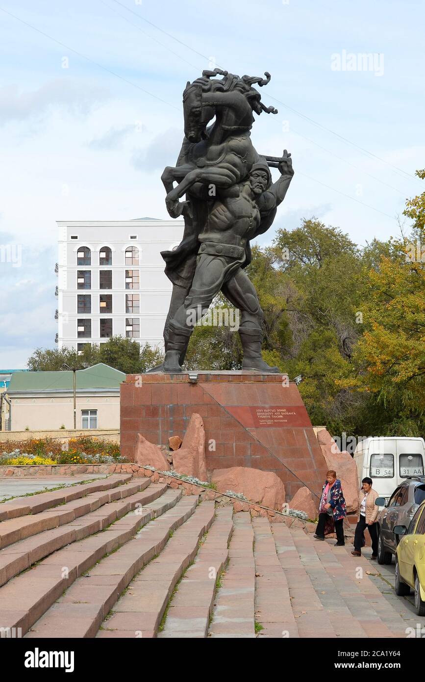 Statue of Kozhomkul, a local kyrgyz strongman carrying a horse. Also ...