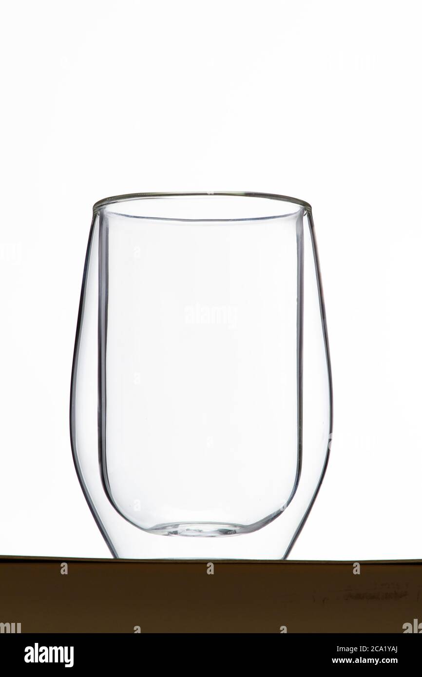 empty glass cup on a white background Stock Photo - Alamy