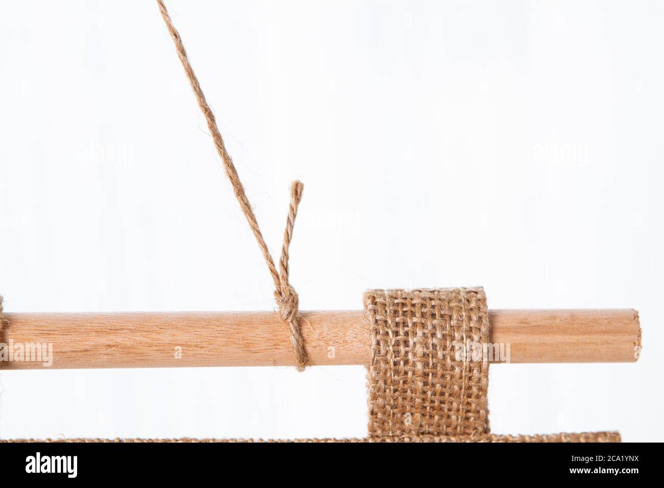 wooden board with rope Stock Photo - Alamy