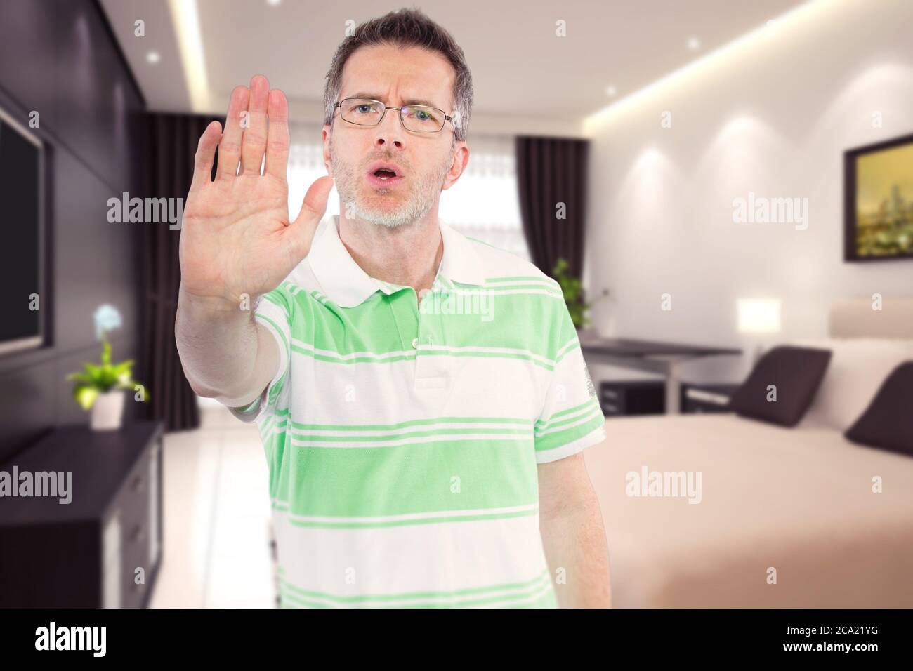 Male guest is angry and upset over a travel ban or being orderedf to be ...