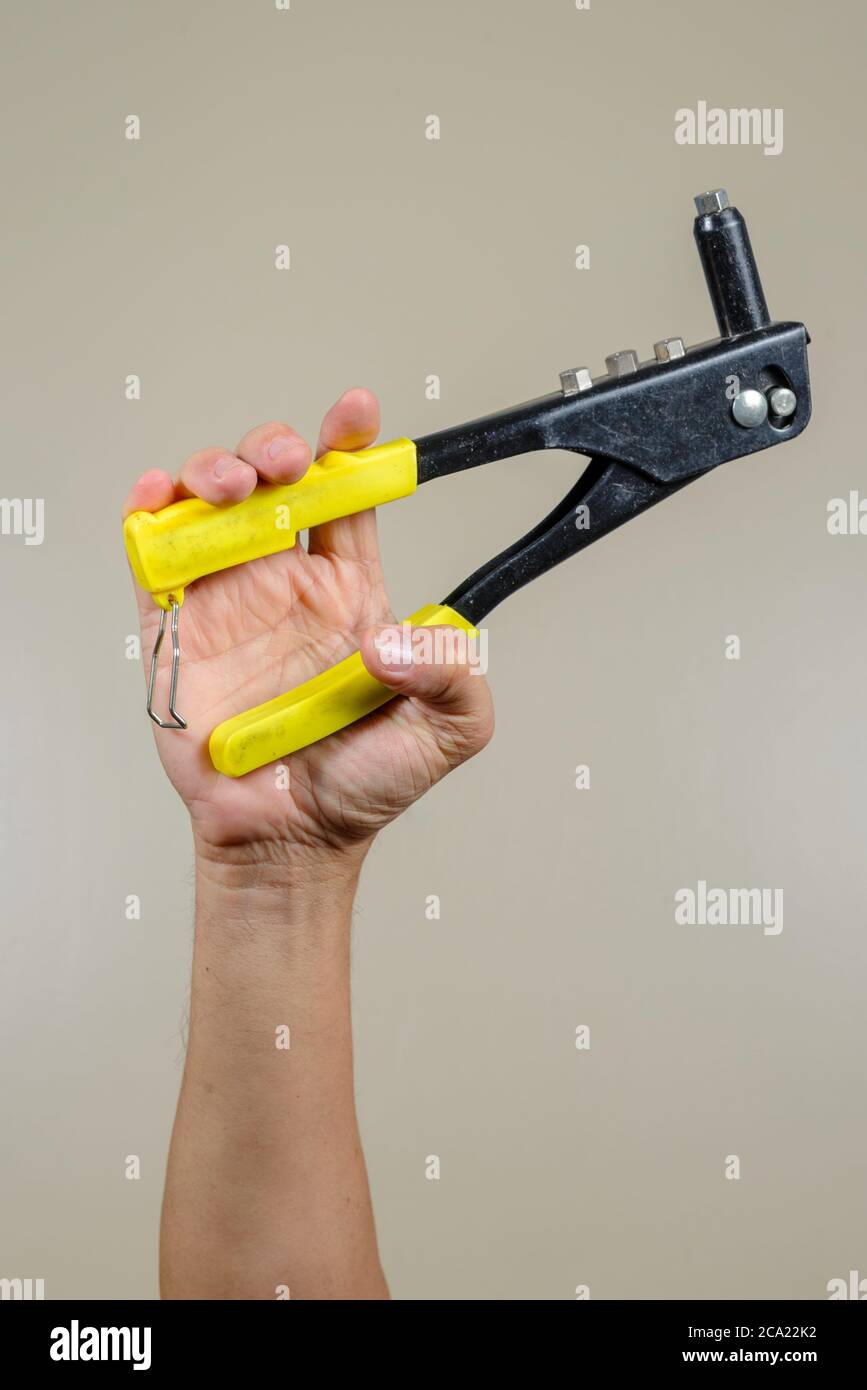 industry worker hand holding mechanical tool Stock Photo - Alamy
