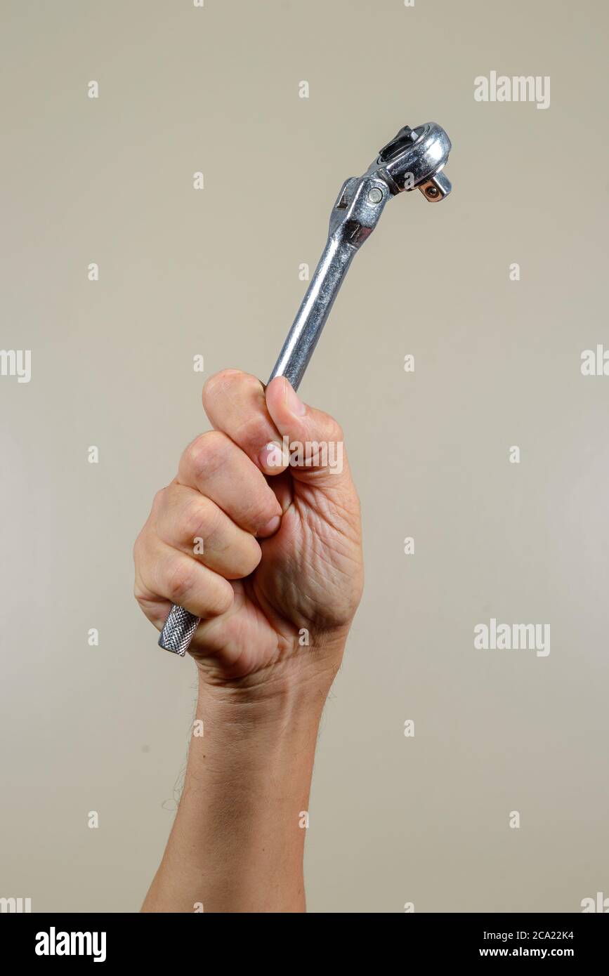 industry worker hand holding mechanical tool Stock Photo - Alamy
