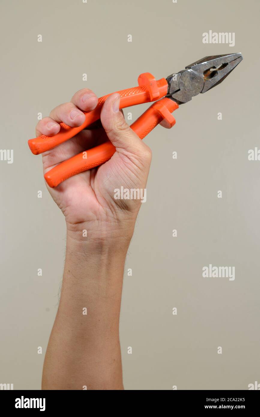 industry worker hand holding mechanical tool Stock Photo - Alamy