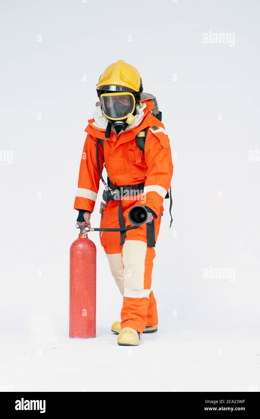 A portrait of Asian male firefighter in red protective uniform, mask ...