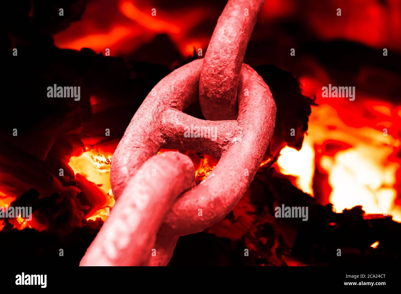 Iron chain links heated by a furnace fire Stock Photo - Alamy
