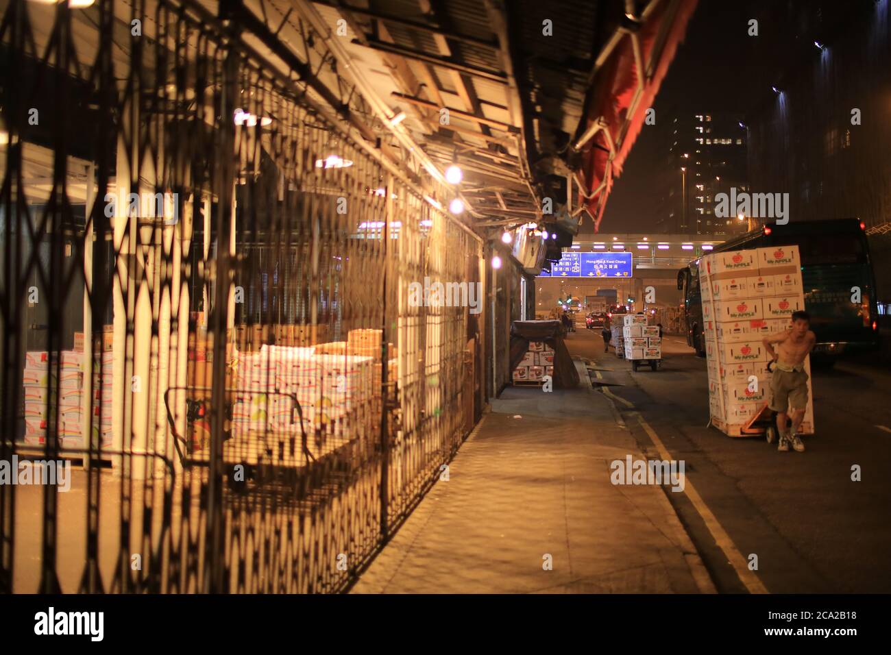 the fruits are packed in Yau Ma Tei Wholesale Fruit Market at night ...