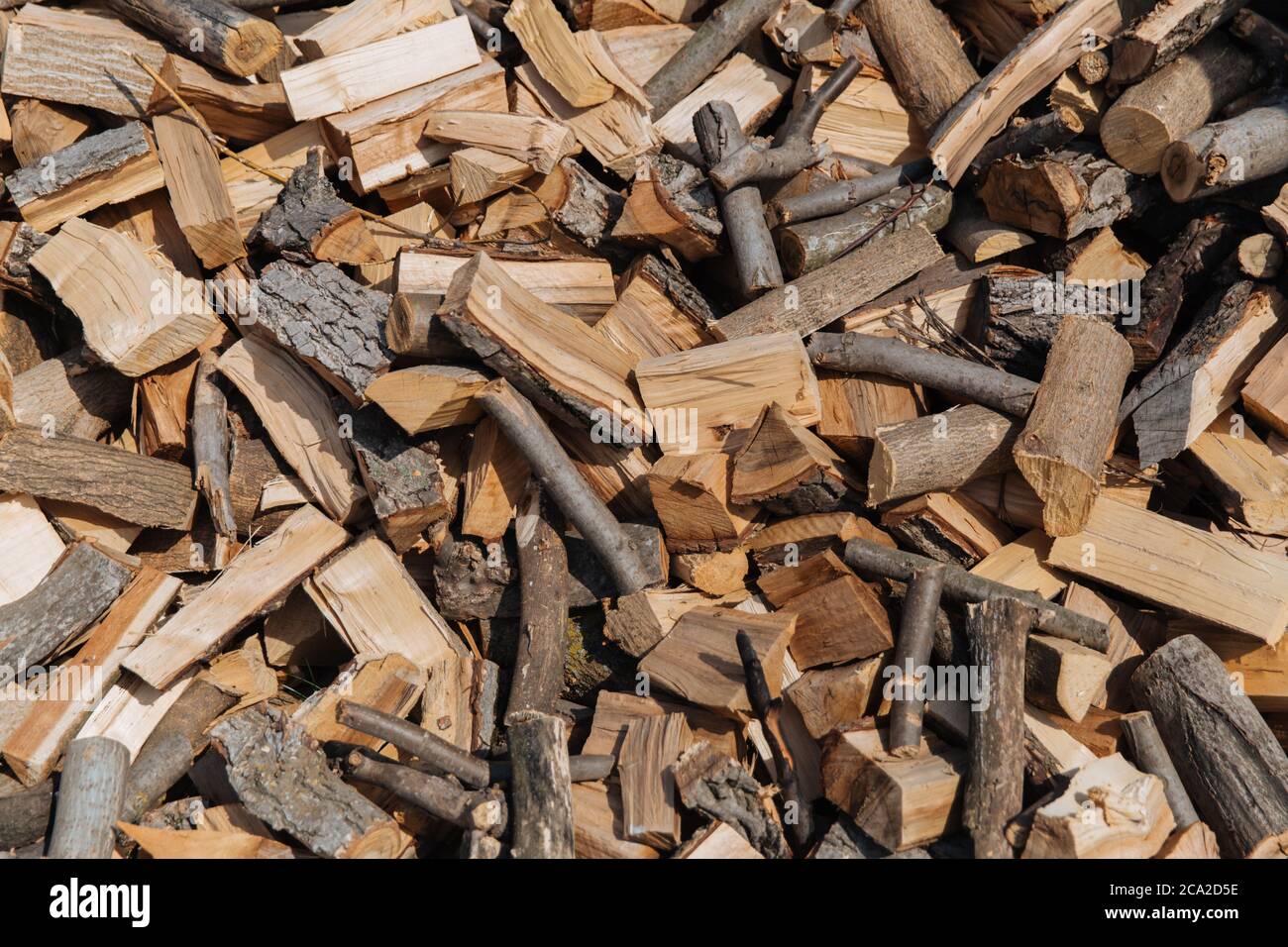 Texture, chopped firewood from different species of trees. Preparation ...