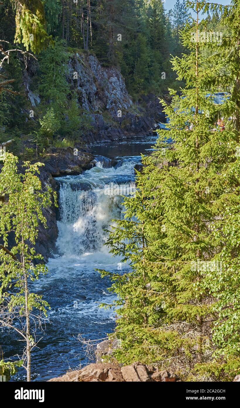 Long multistage flat waterfall. Seething waves and water falling on ...