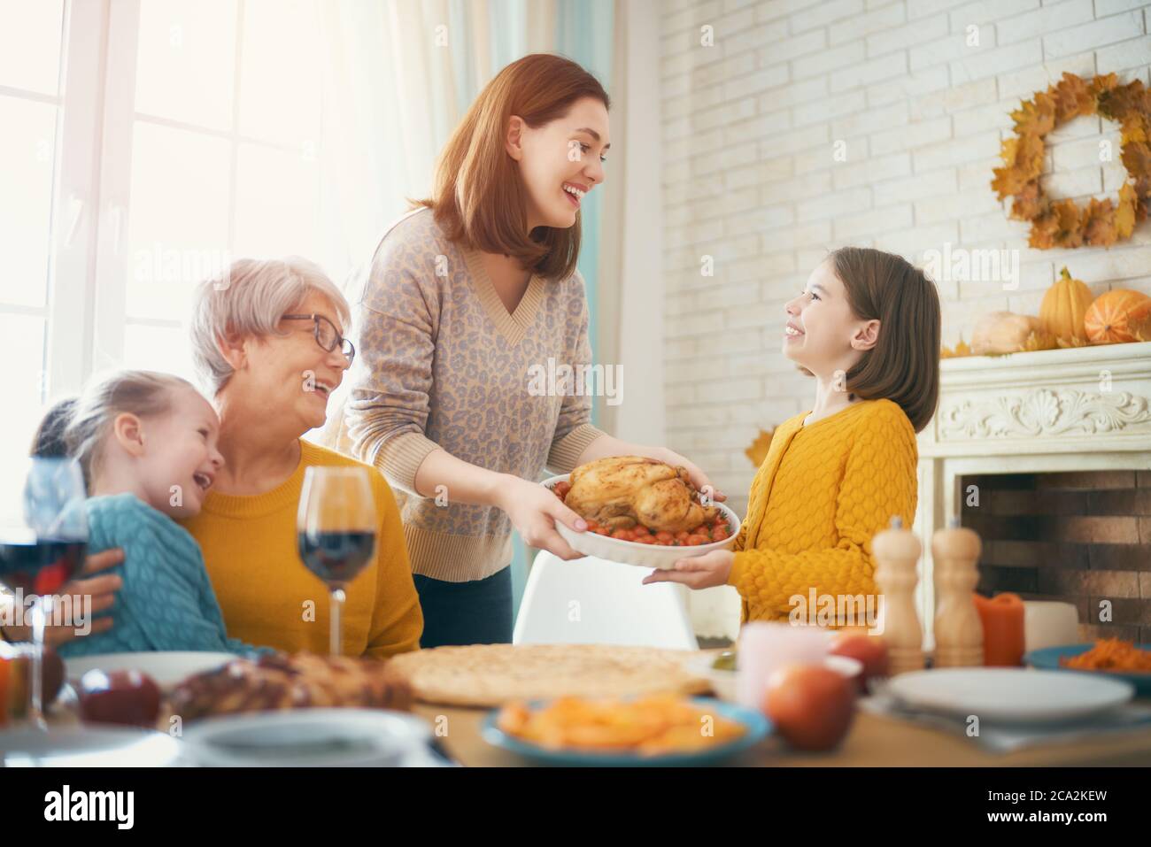 Happy Thanksgiving Day! Autumn feast. Family sitting at the table and ...