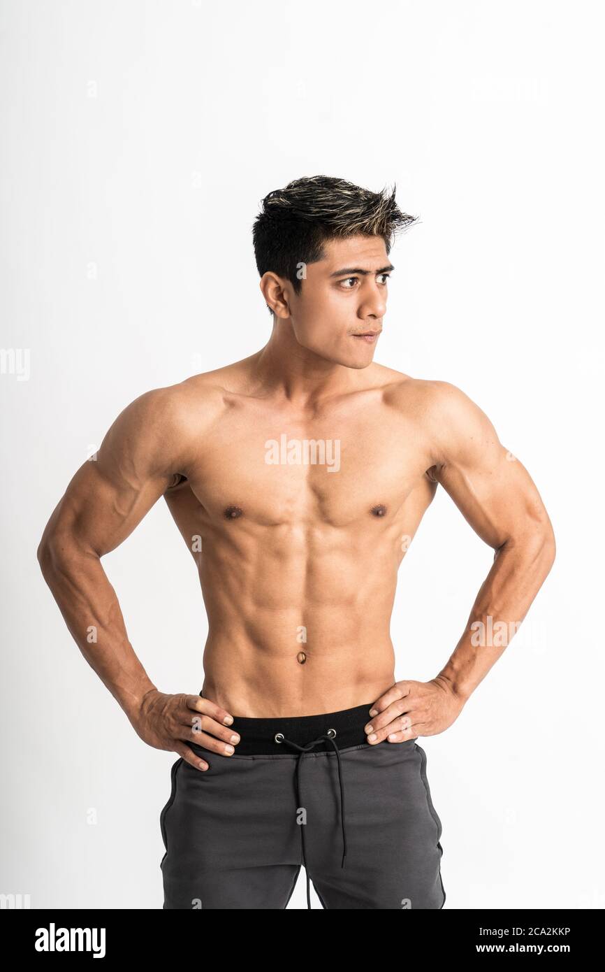 Sexy man show muscular bodies with two hands on waist stand facing ...