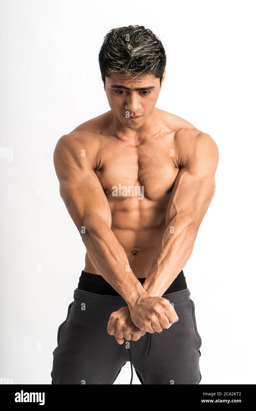 asian man showing a muscular body with two arms stretch forward stand ...