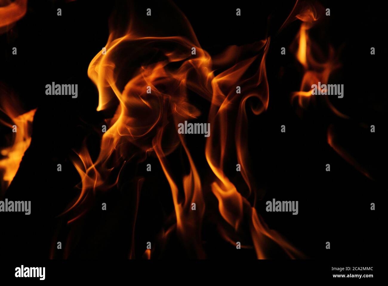 red and orange fire isolated on the black background Stock Photo - Alamy