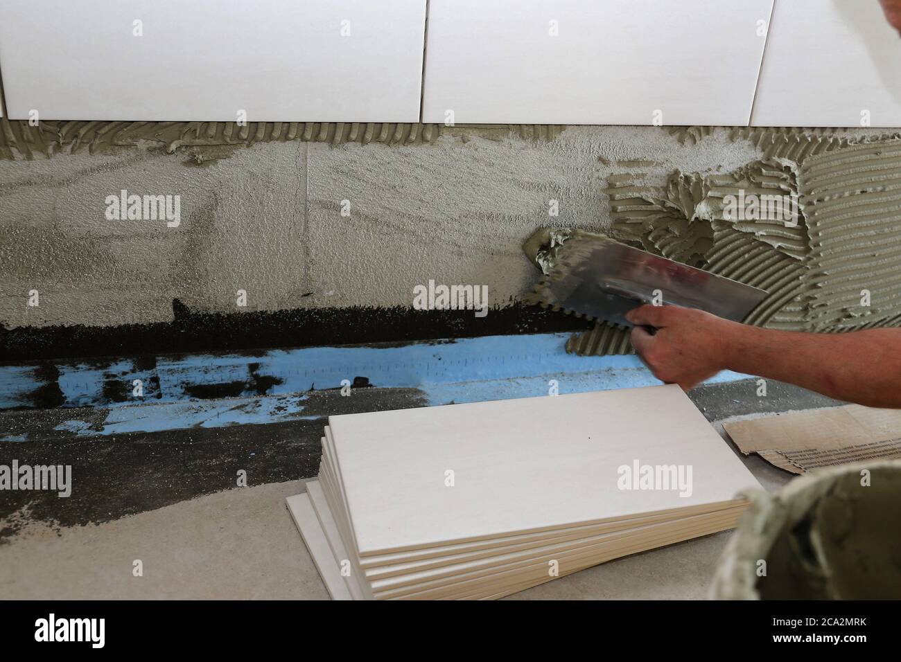 Installing tiles hi-res stock photography and images - Alamy