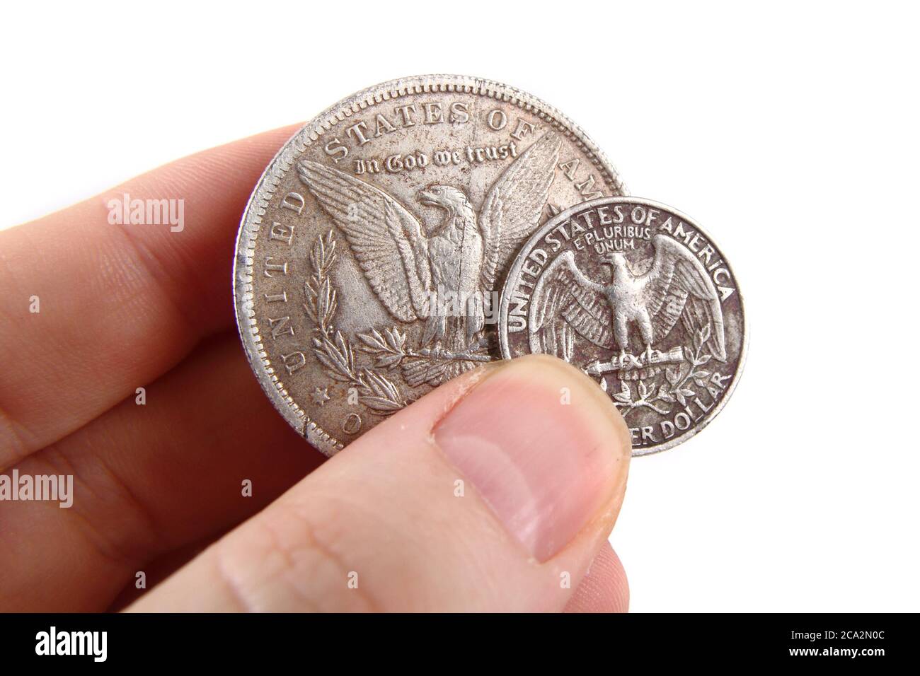 dollar coins in human hand isolated on the white background Stock Photo ...