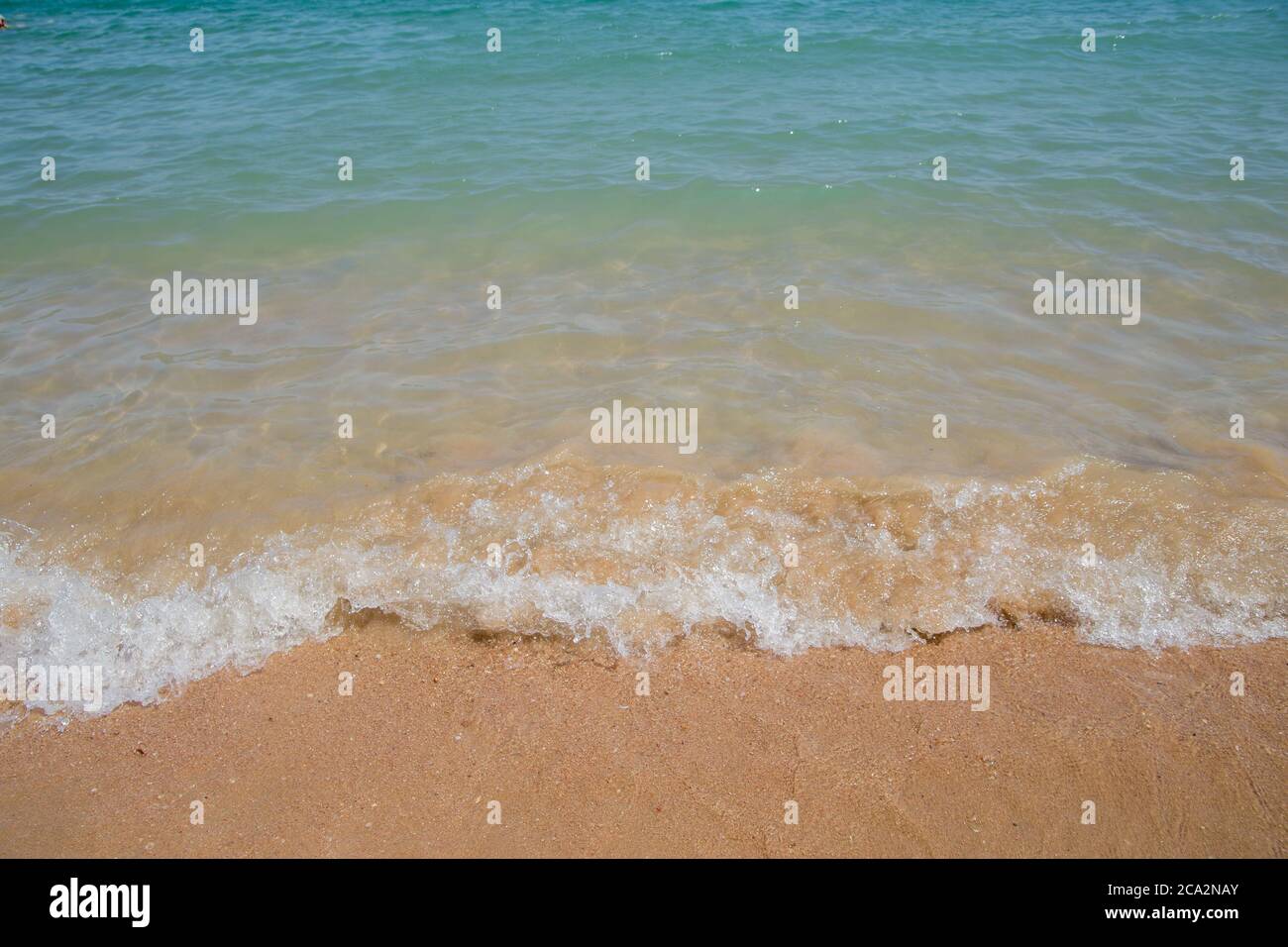 clear azure water on beach with sand Stock Photo - Alamy