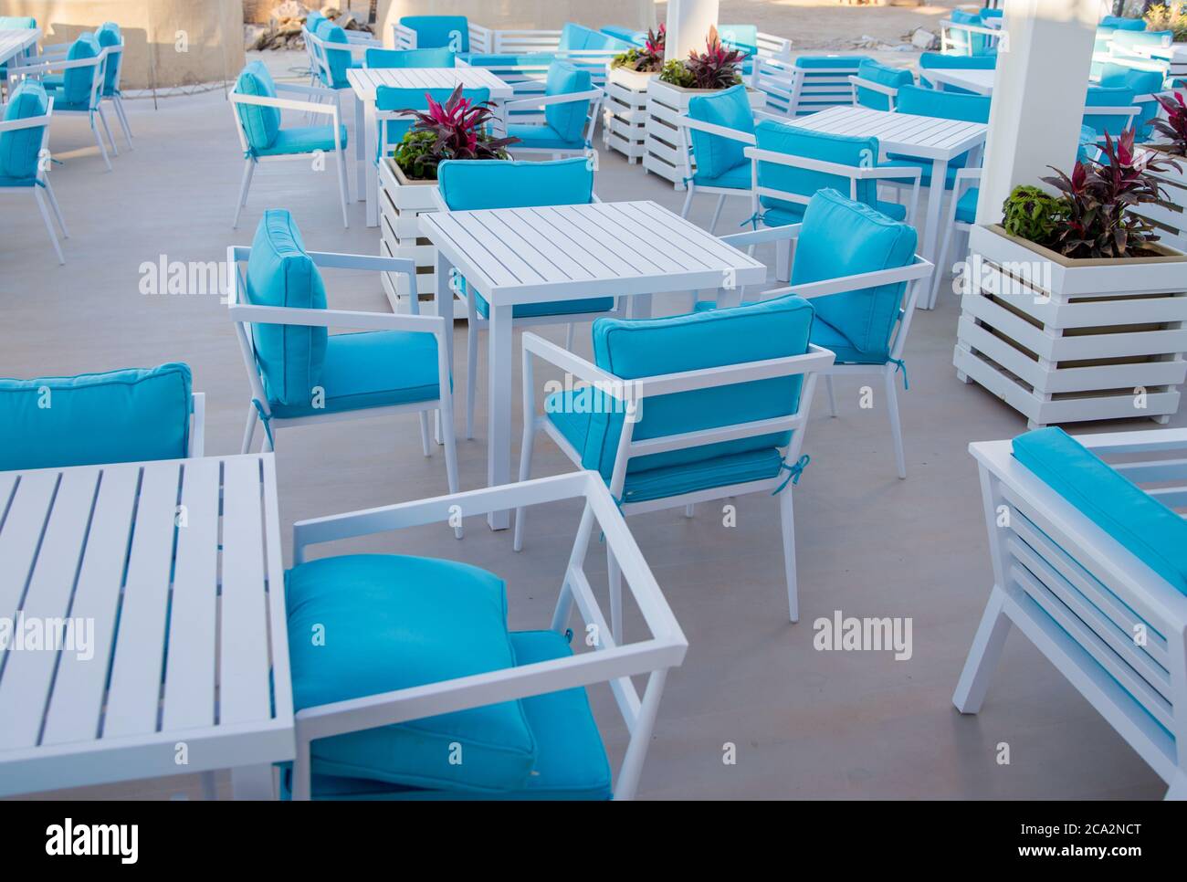 chairs and tables in beach restaurant Stock Photo - Alamy