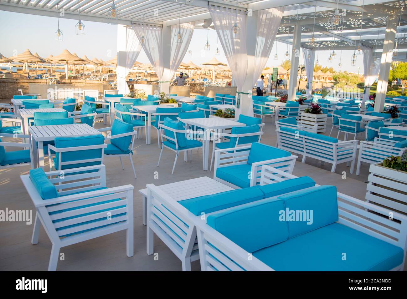 chairs and tables in beach restaurant Stock Photo - Alamy