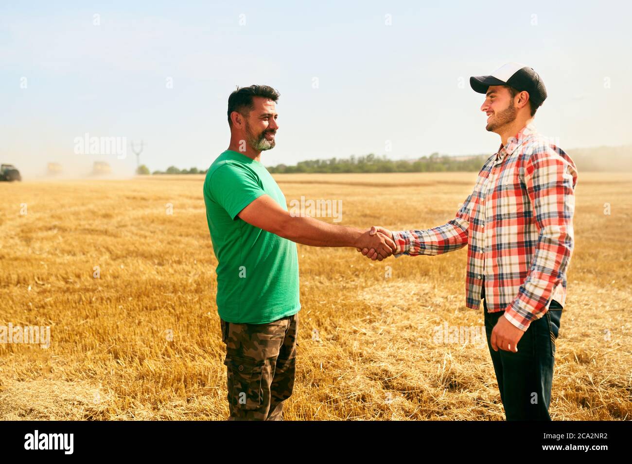 Farmer and businessman shake hands hi-res stock photography and images ...