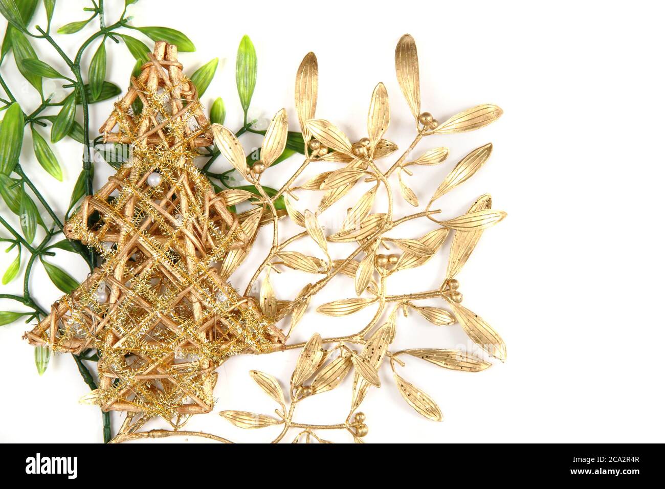 green and gold christmas mistletoe isolated on the white background ...
