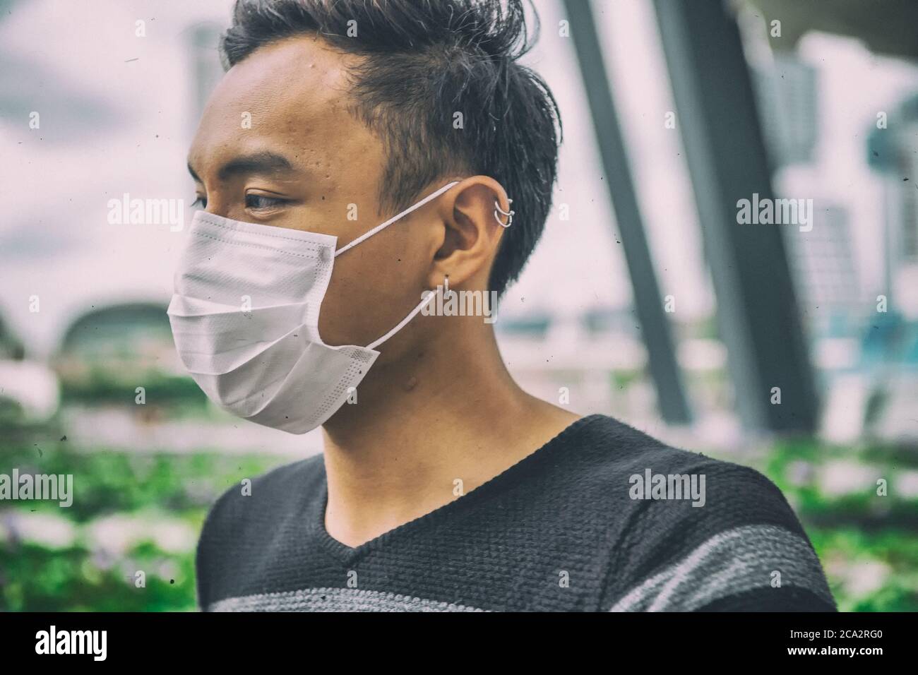 Beautiful asian man outdoor wearing face mask Stock Photo - Alamy