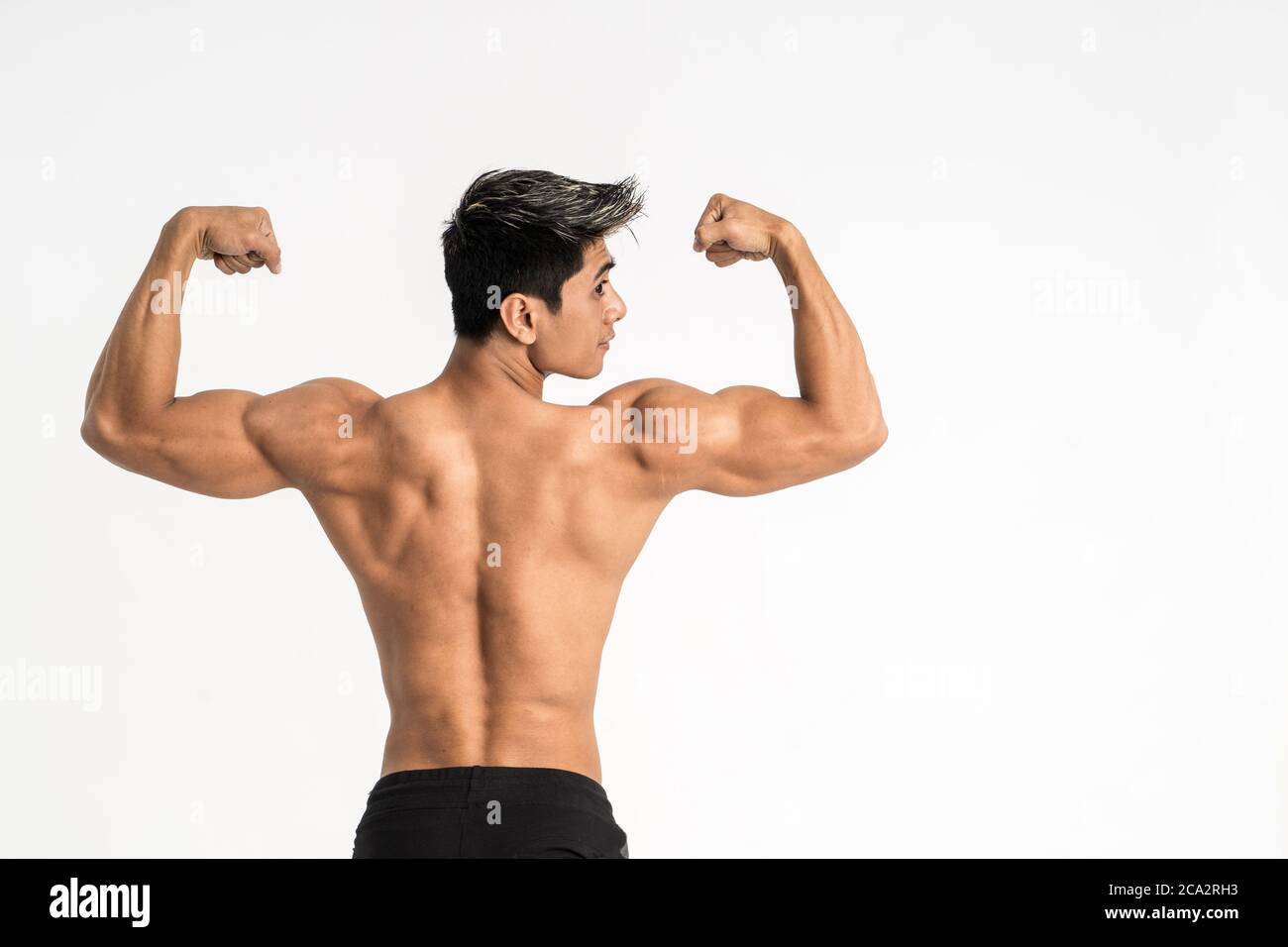 half body image of young man showing muscular body stand facing back on ...
