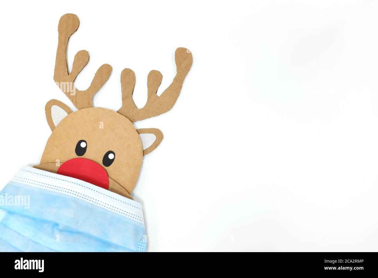 Cardboard cutout of Rudolph the red-nosed reindeer peeking while ...