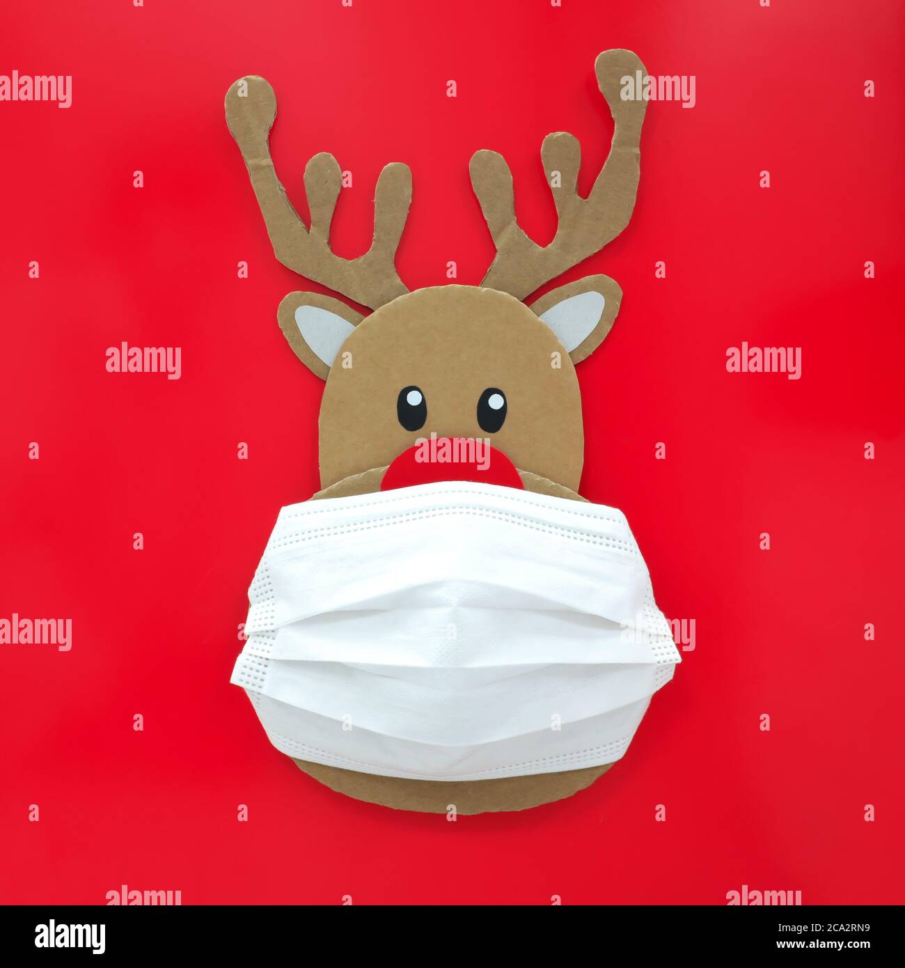 Cardboard cutout of cute reindeer wearing a face mask. Covid during ...
