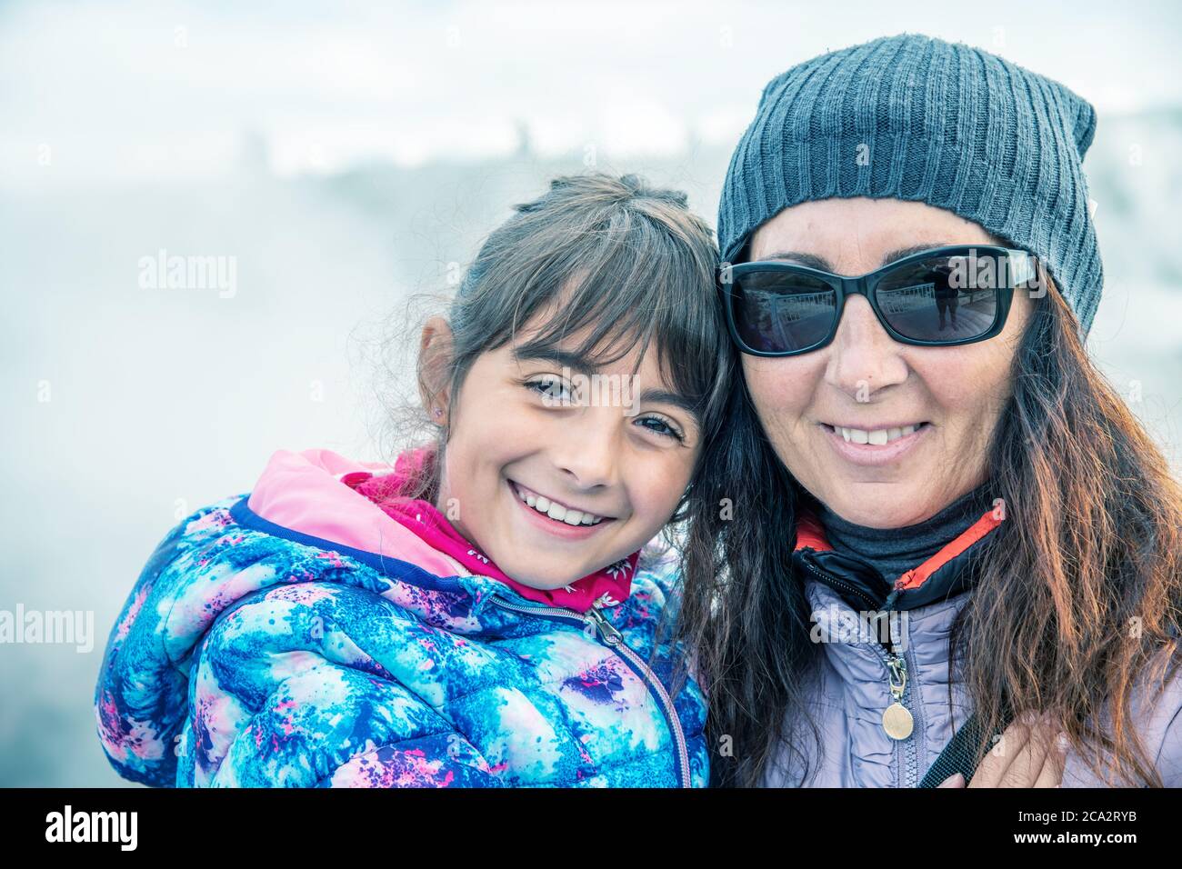 Happy woman with her daughter enjoying geothermal valley Stock Photo ...