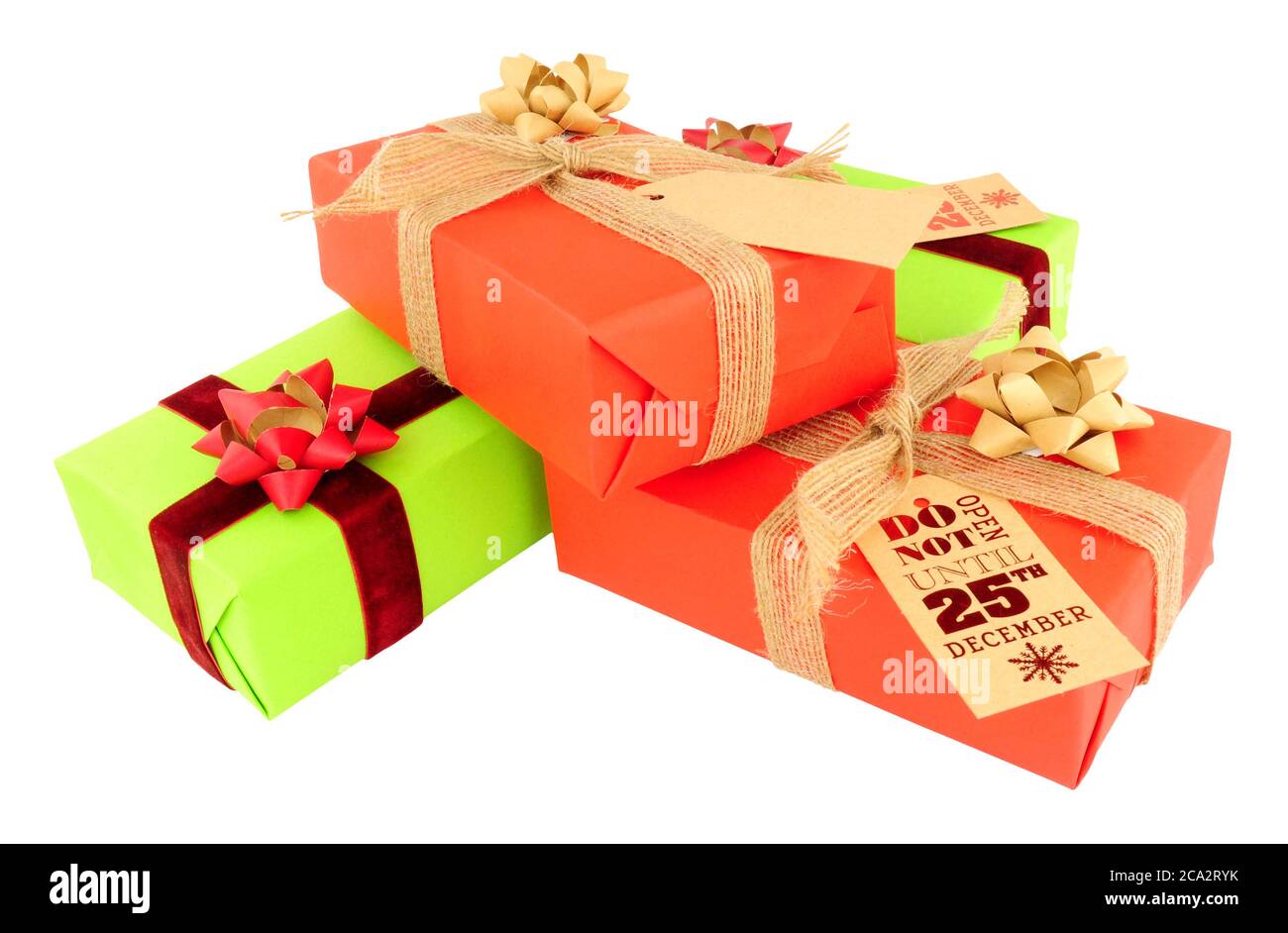Christmas parcels wrapped in red and green paper with ribbons and bows ...