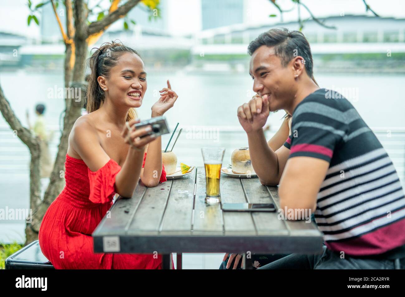 Happy young asian couple meeting outdoor Stock Photo - Alamy