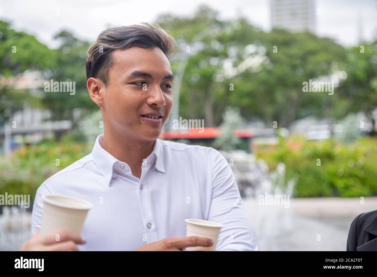 Business meeting outdoor. Asian man speaking with other people Stock ...
