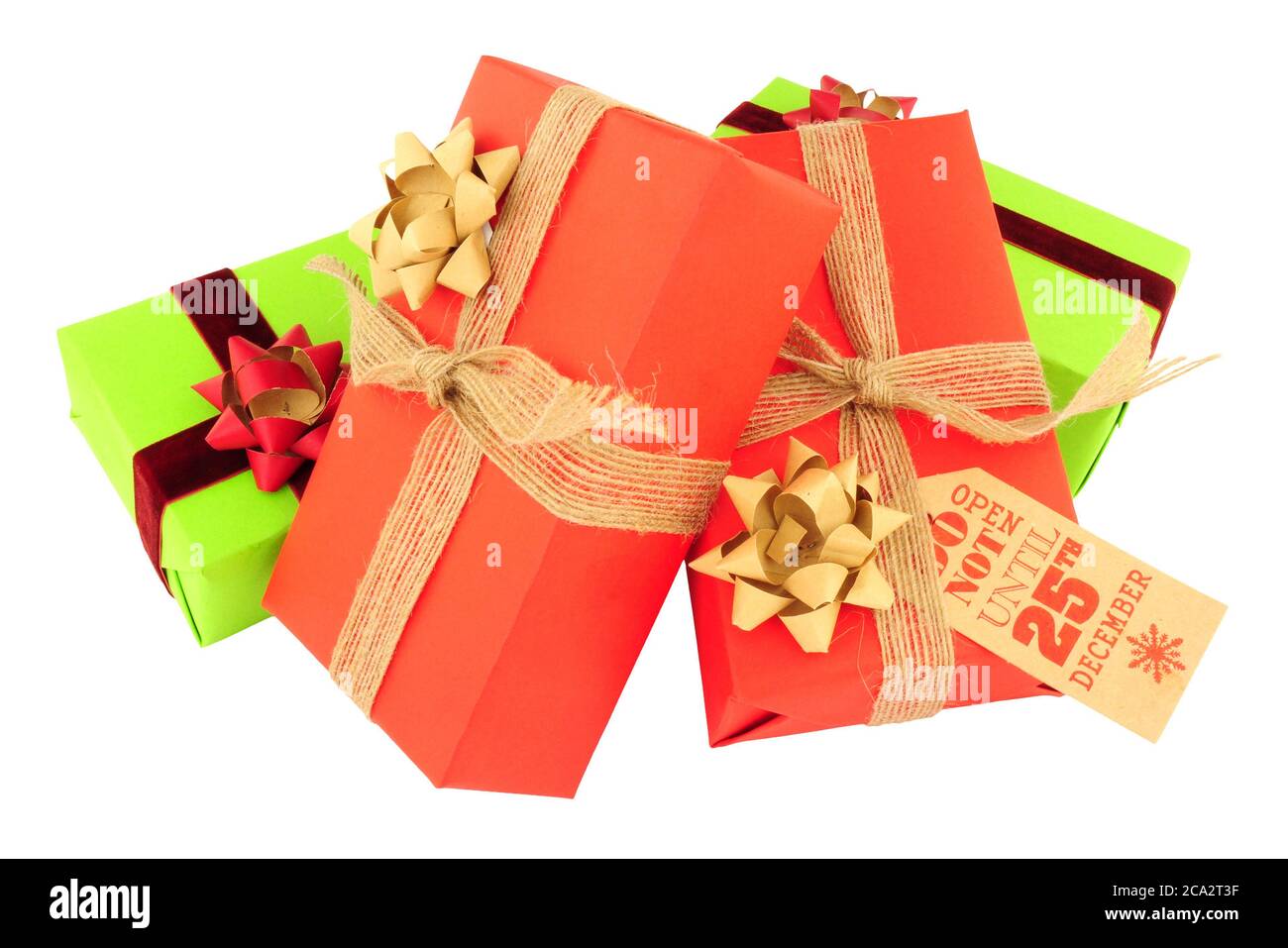Christmas parcels wrapped in red and green paper with ribbons and bows ...